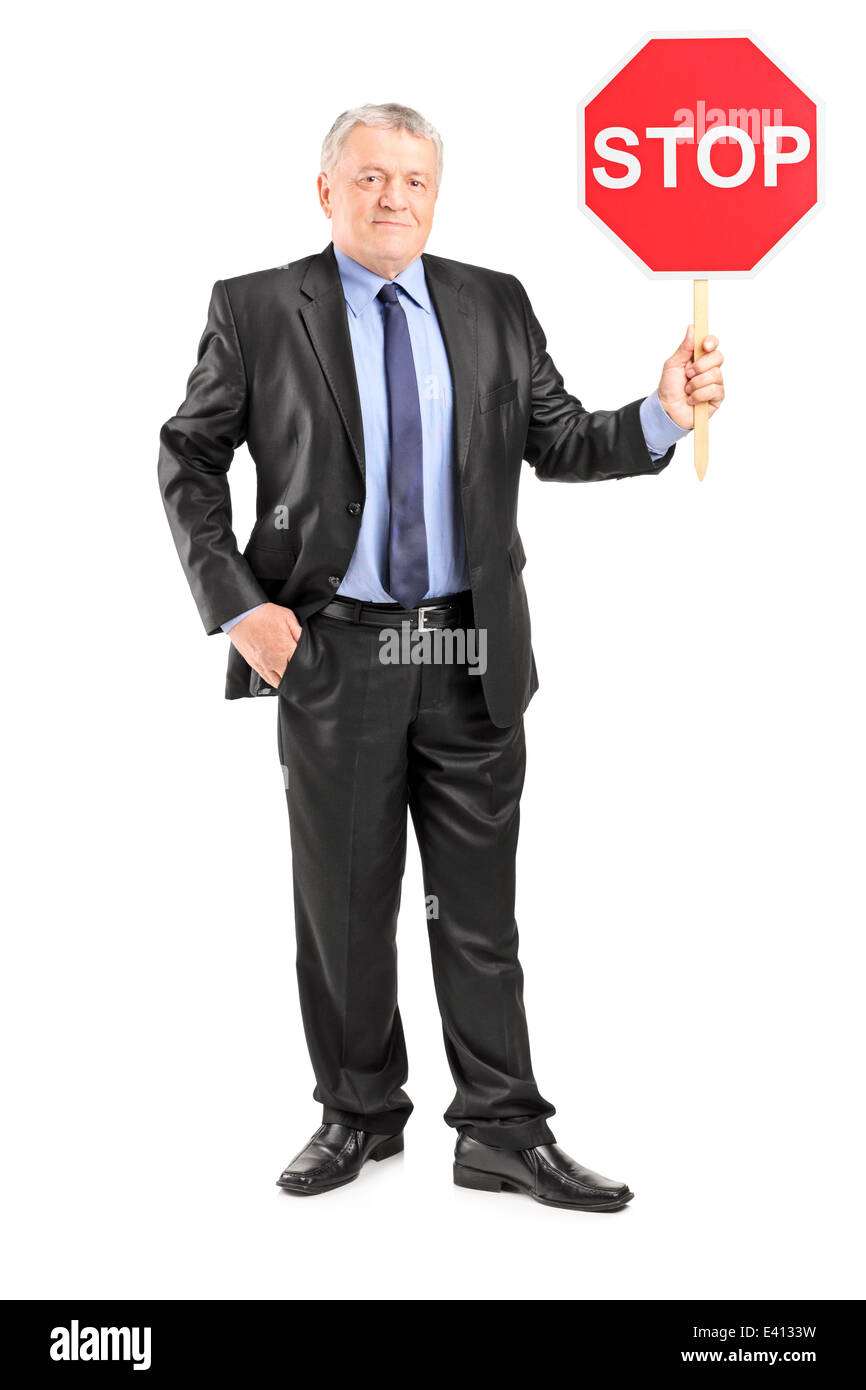 Full length portrait of a mature businessman holding a stop sign Stock ...