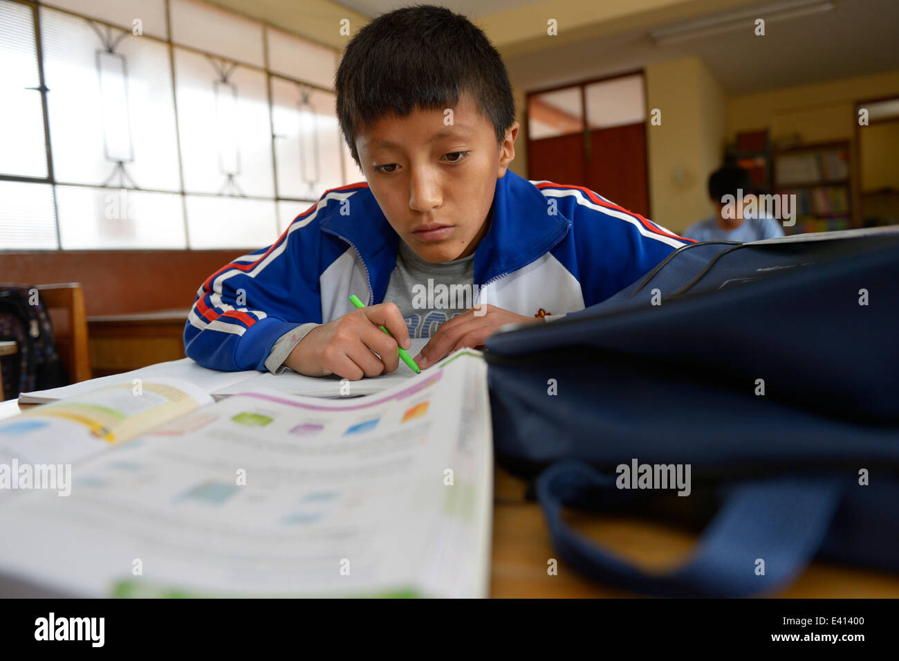 Peru, Ayacucho, pupil doing homework in classroom Stock Photo - Alamy