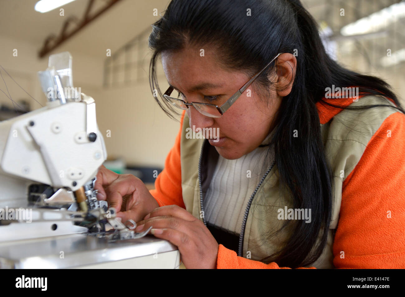 South America, Bolivia, El Alto, Female dressmaker working with the ...