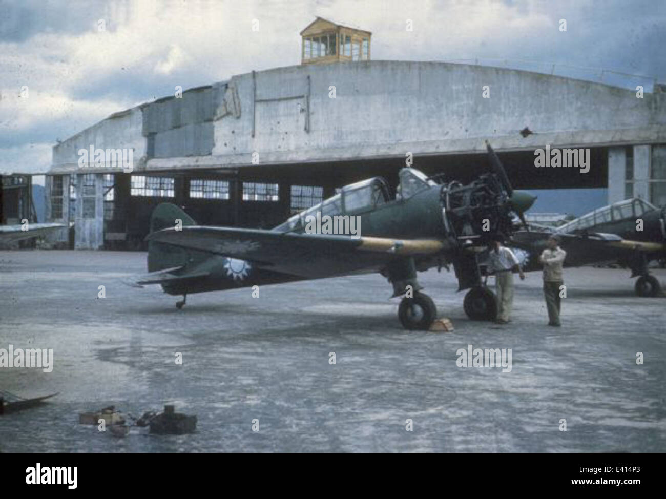 Chinese trainer aircraft in front of a hangar, part of the 118th ...