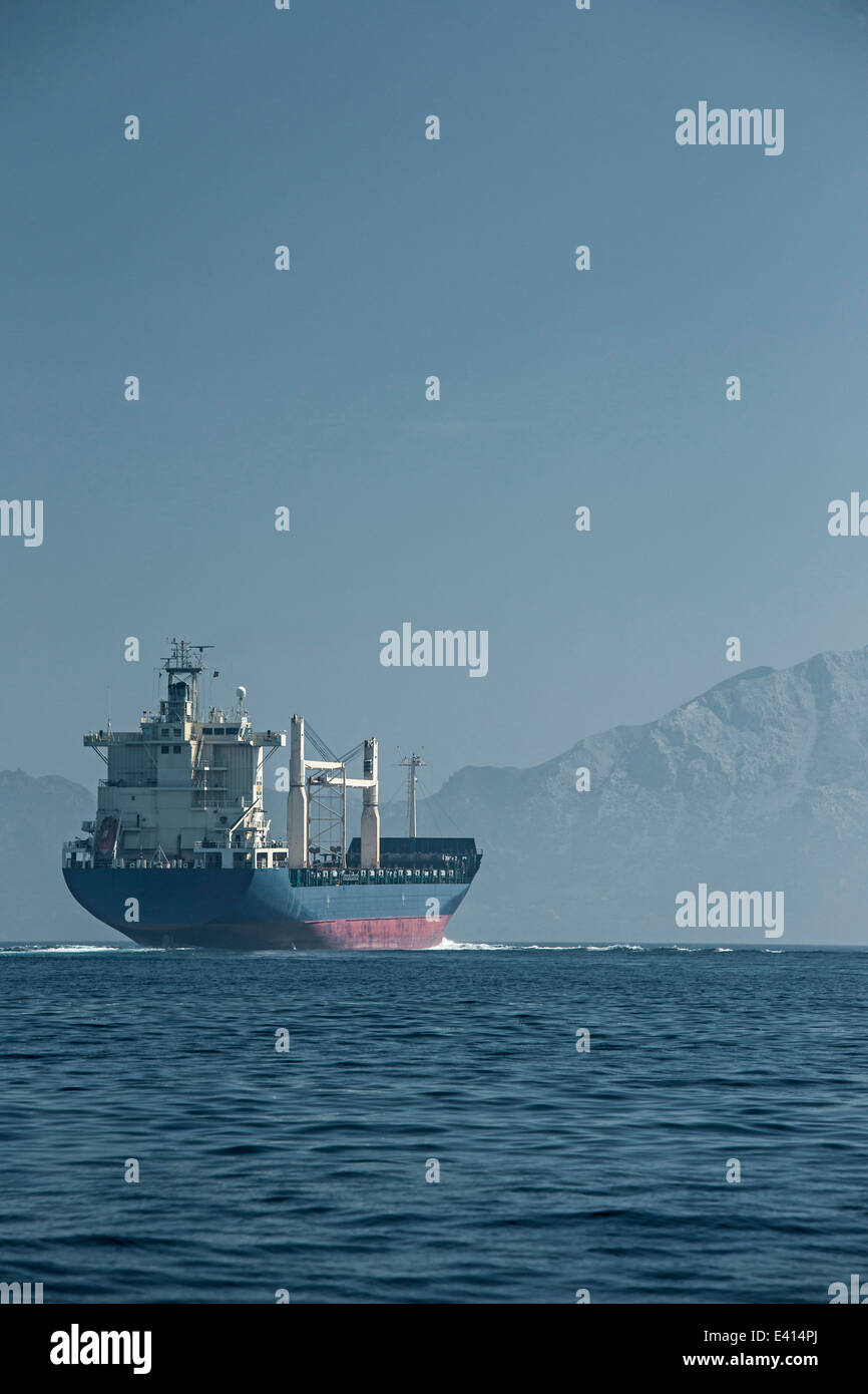 Africa, Morocco, Tanger, Cargo ship in front of Jebel Musa, Strait of ...
