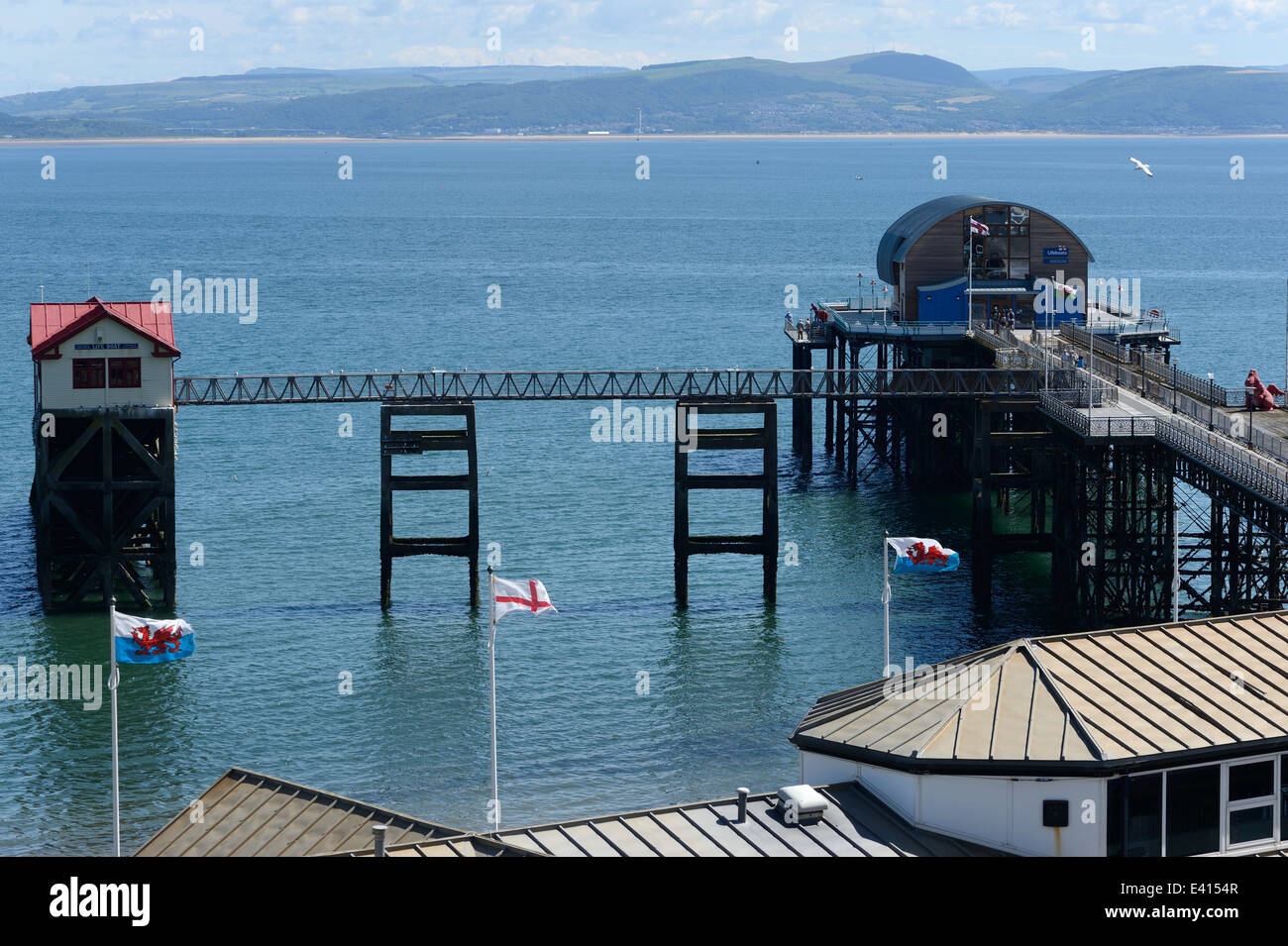 mumbles lifeboat stations old (left) and new (right) with flags flying ...