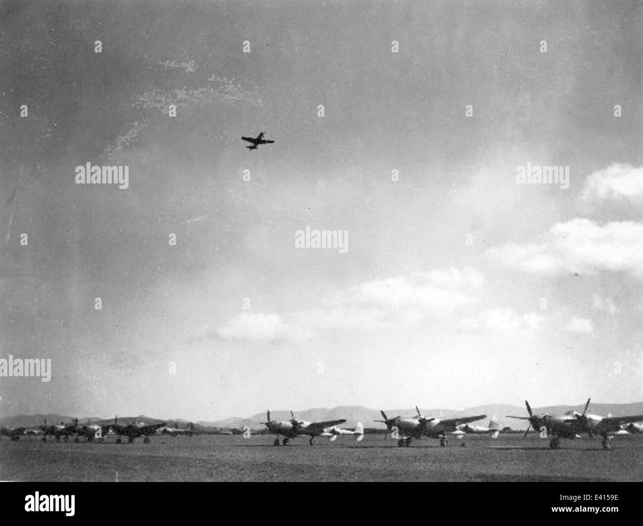 A photograph of 15 P-38 aircraft from the 118th Tactical Reconnaissance ...