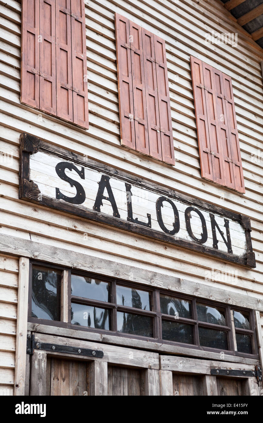 Saloon sign on western wooden building, nobody Stock Photo - Alamy