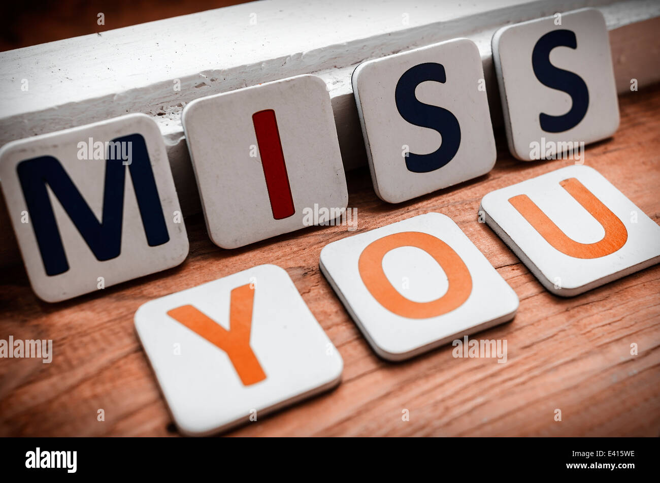 Words miss you laid out letters on a wooden background Stock Photo - Alamy