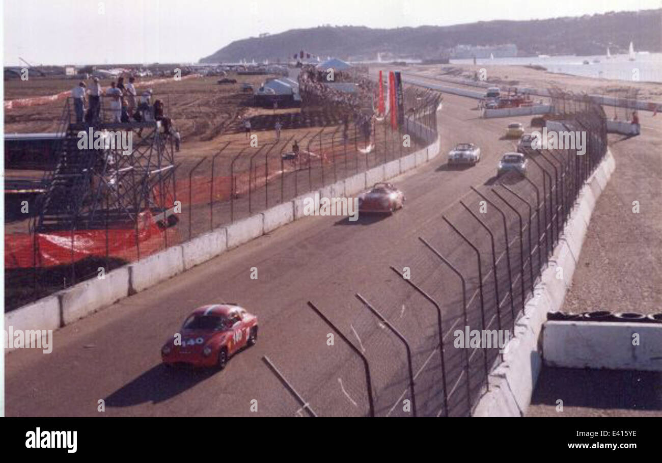 A photograph capturing a sport car race, showcasing the high-speed ...