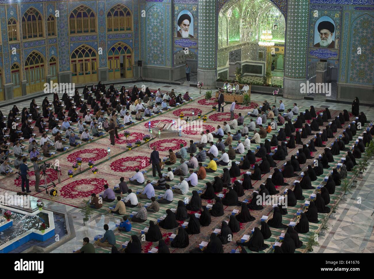 Aran And Bidgol, Iran. 2nd July, 2014. Iranian men and women recite ...