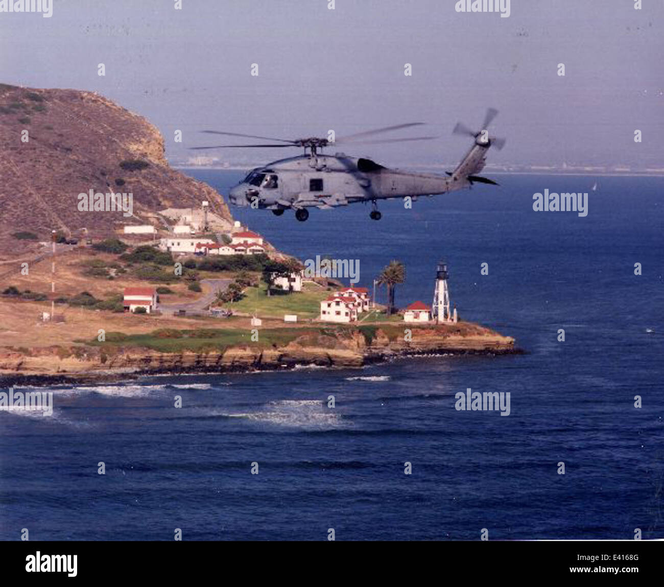 An SH-60B Seahawk helicopter from HSL-45, flying over Pt. Loma ...