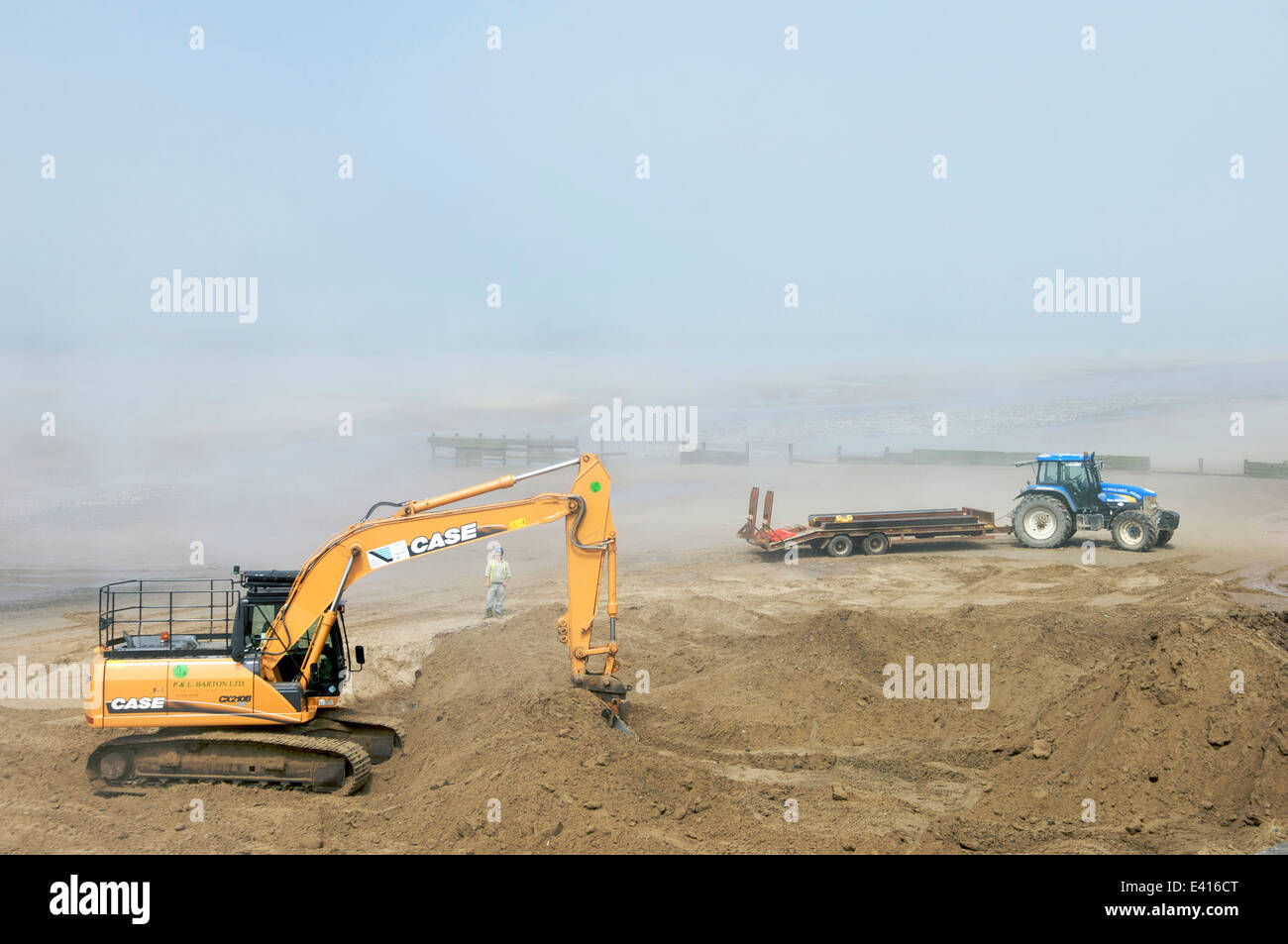 Excavator digging sand on beach hi-res stock photography and images - Alamy