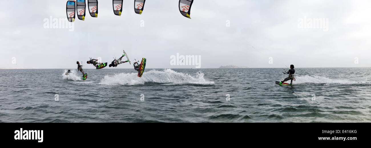 Frame by frame composition of man kitesurfing a jump on the horizon of ...