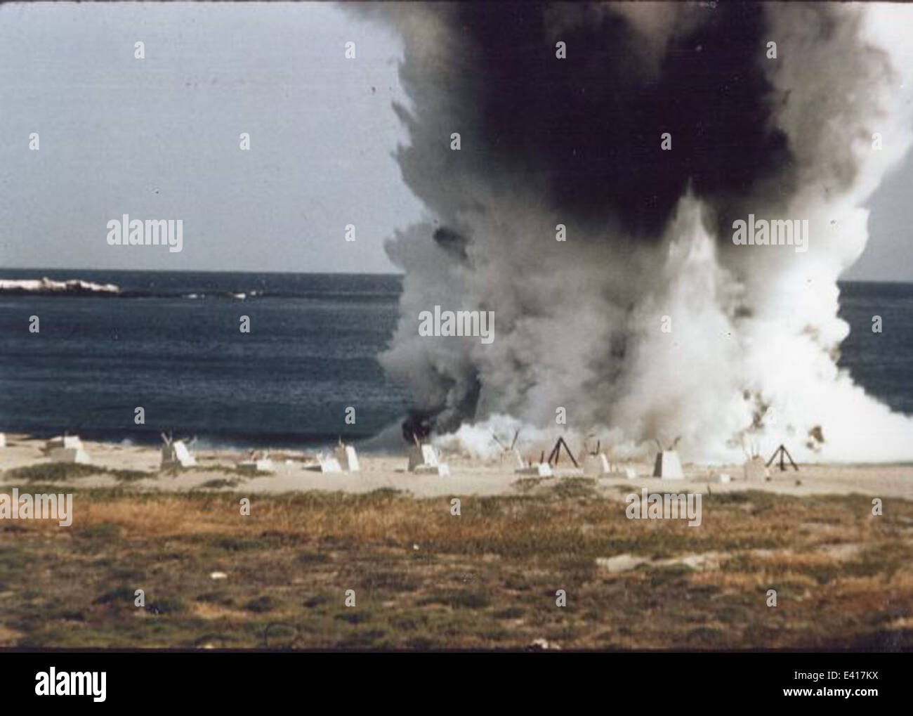 A photograph of military personnel undergoing training to destroy beach ...