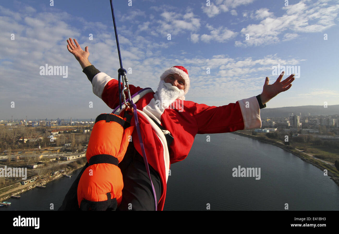 A man dressed like Santa Claus jumps over the 52 meters altitude ...
