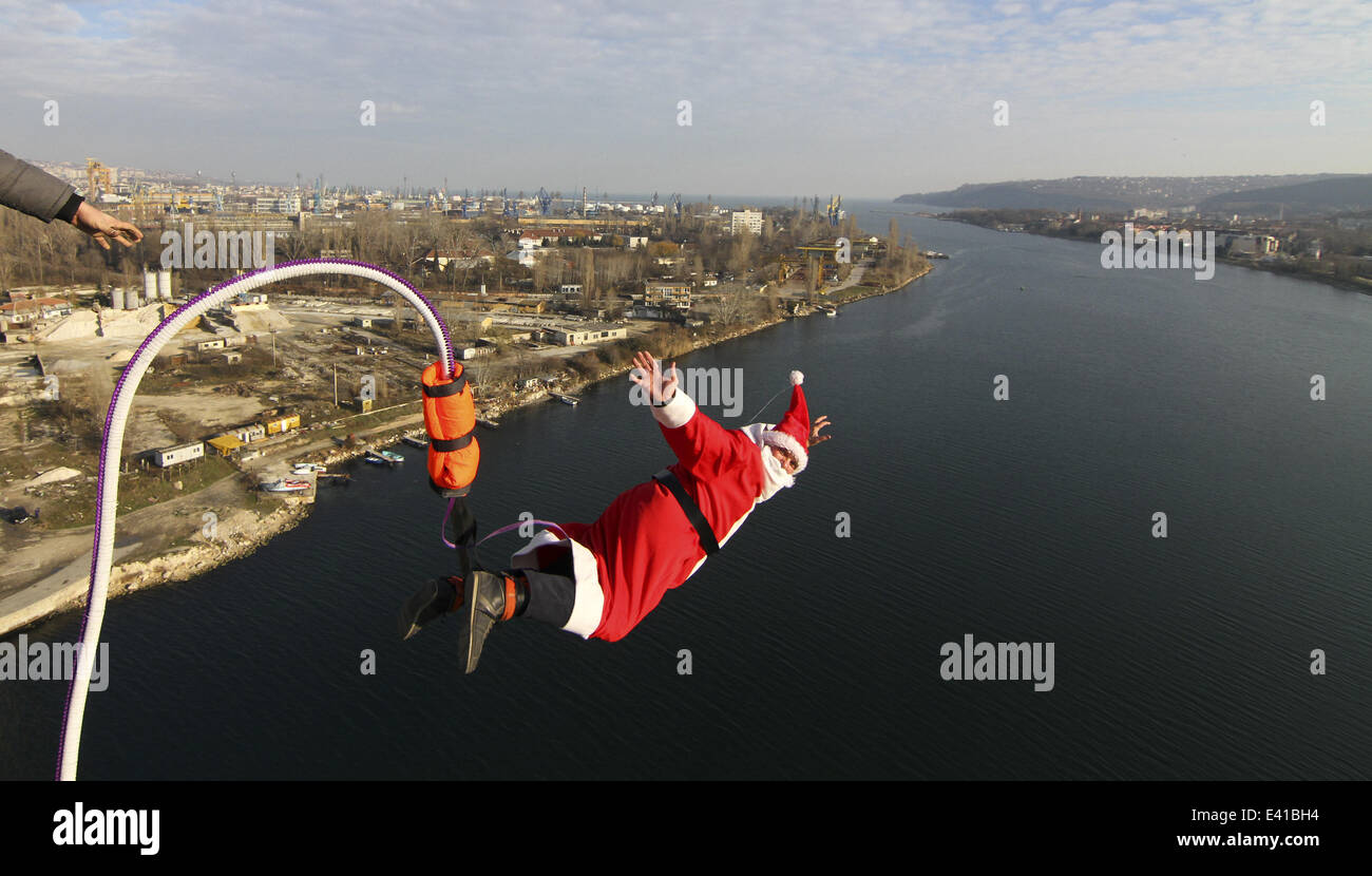 A man dressed like Santa Claus jumps over the 52 meters altitude ...