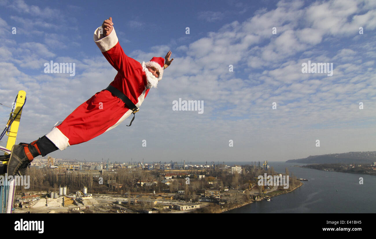 A man dressed like Santa Claus jumps over the 52 meters altitude ...