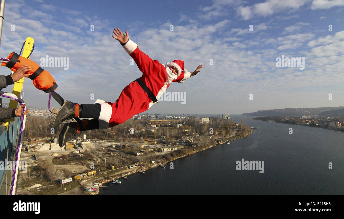 A man dressed like Santa Claus jumps over the 52 meters altitude ...