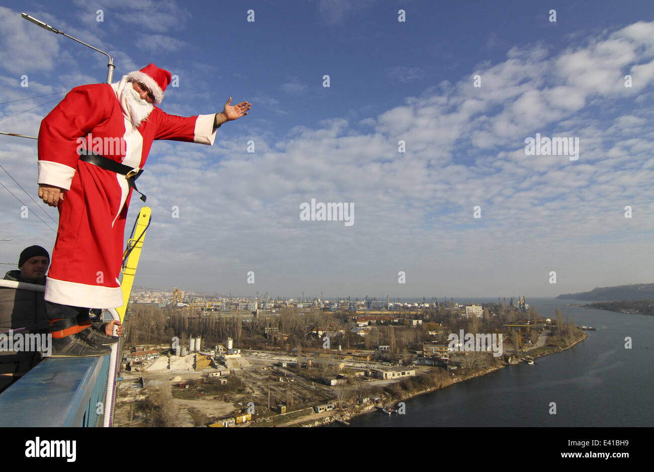 A man dressed like Santa Claus jumps over the 52 meters altitude ...