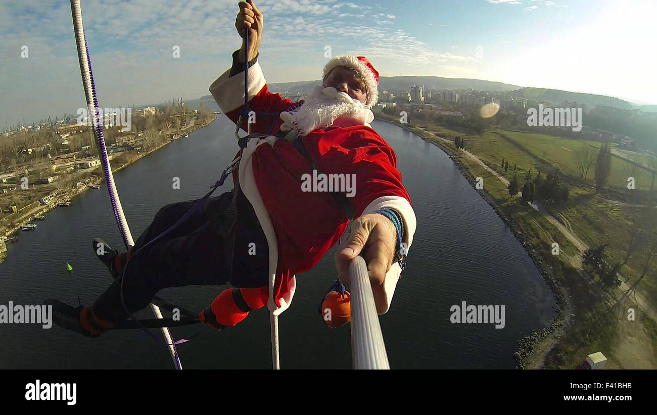A man dressed like Santa Claus jumps over the 52 meters altitude ...