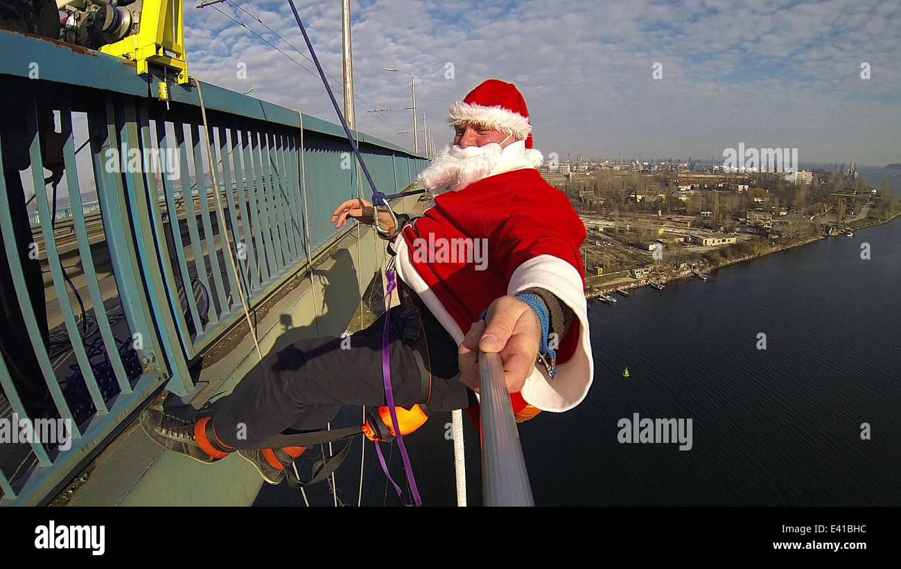 A man dressed like Santa Claus jumps over the 52 meters altitude ...