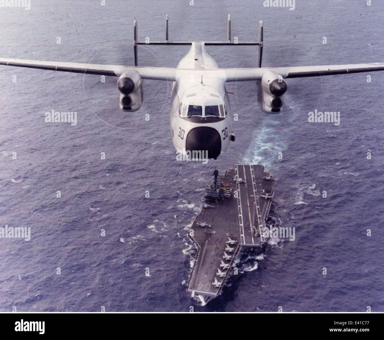 This image shows a U.S. Navy C-2 Greyhound aircraft from Carrier Air ...