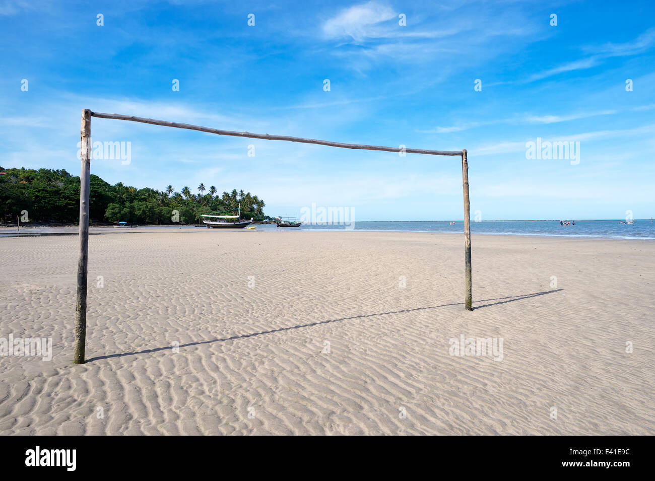 Simple empty Brazilian beach football pitch with rustic wooden goal ...