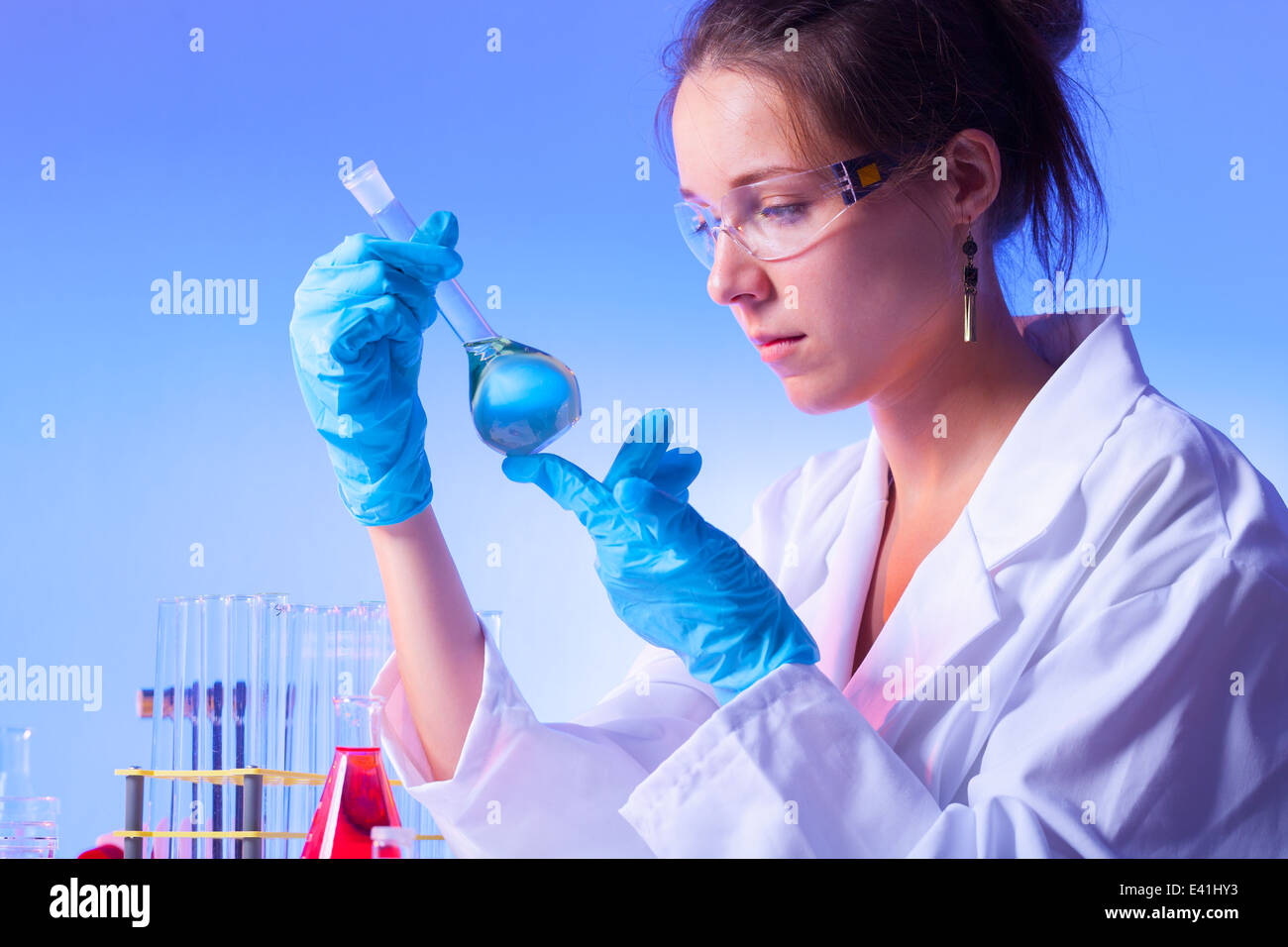 girl with a flask in a laboratory Stock Photo - Alamy