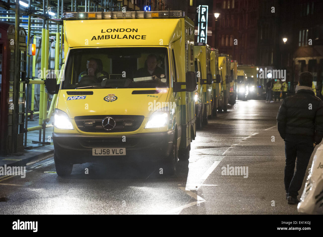 Emergency services move an injured person from a makeshift medical ...