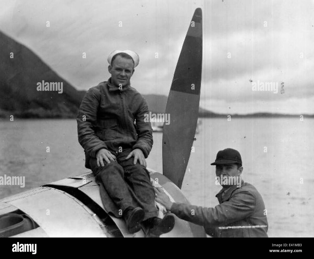 A photograph from 1940 showing two crew members aboard a PBY-3 Catalina ...