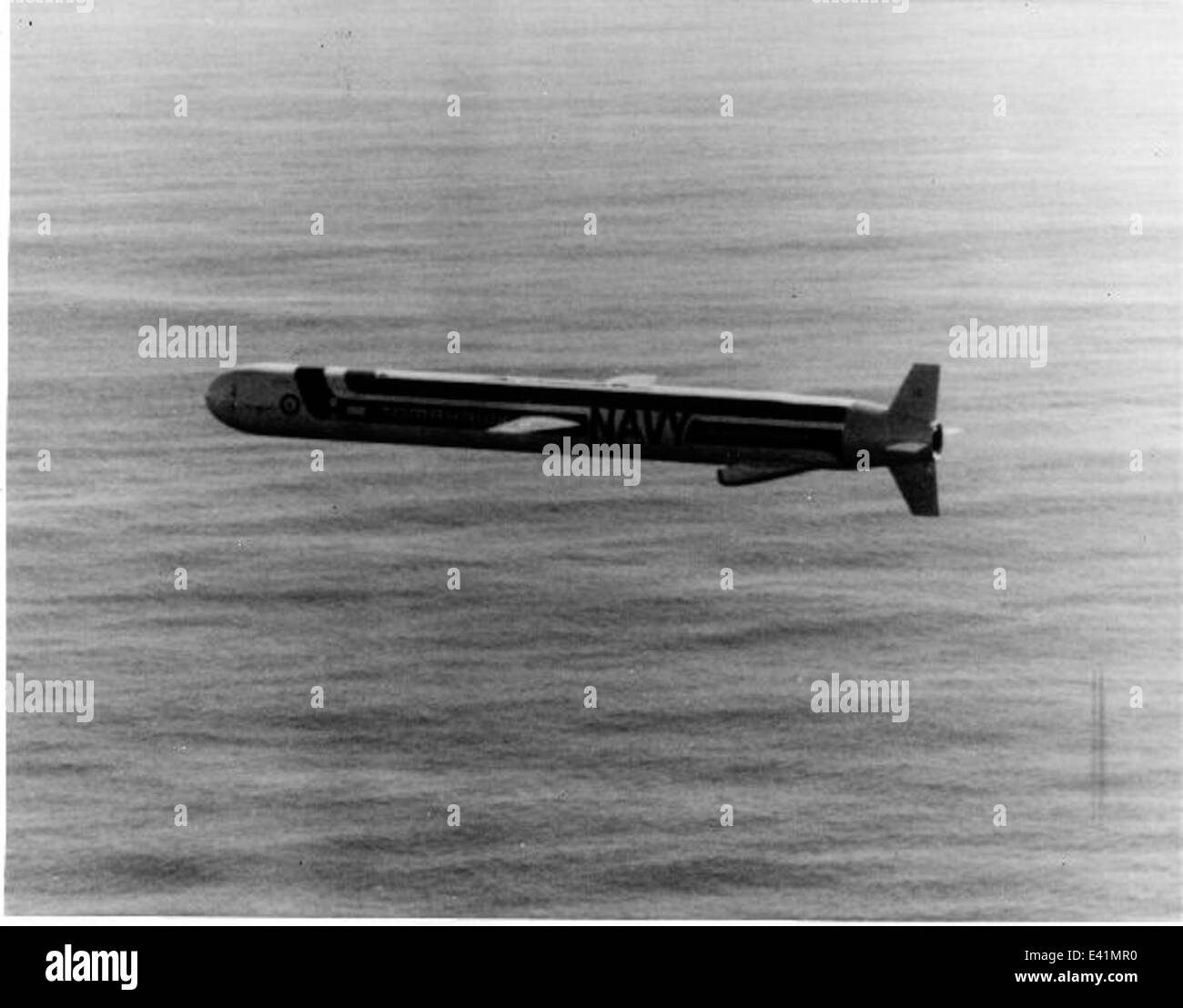A photograph of a Tomahawk missile in flight, captured in 1976. The ...