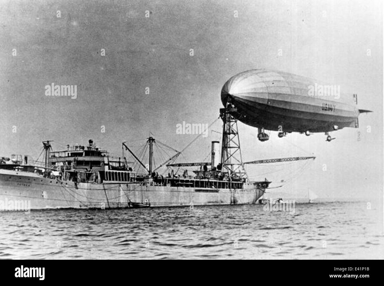 A historical photograph of the USS Shenandoah, a rigid airship, moored ...
