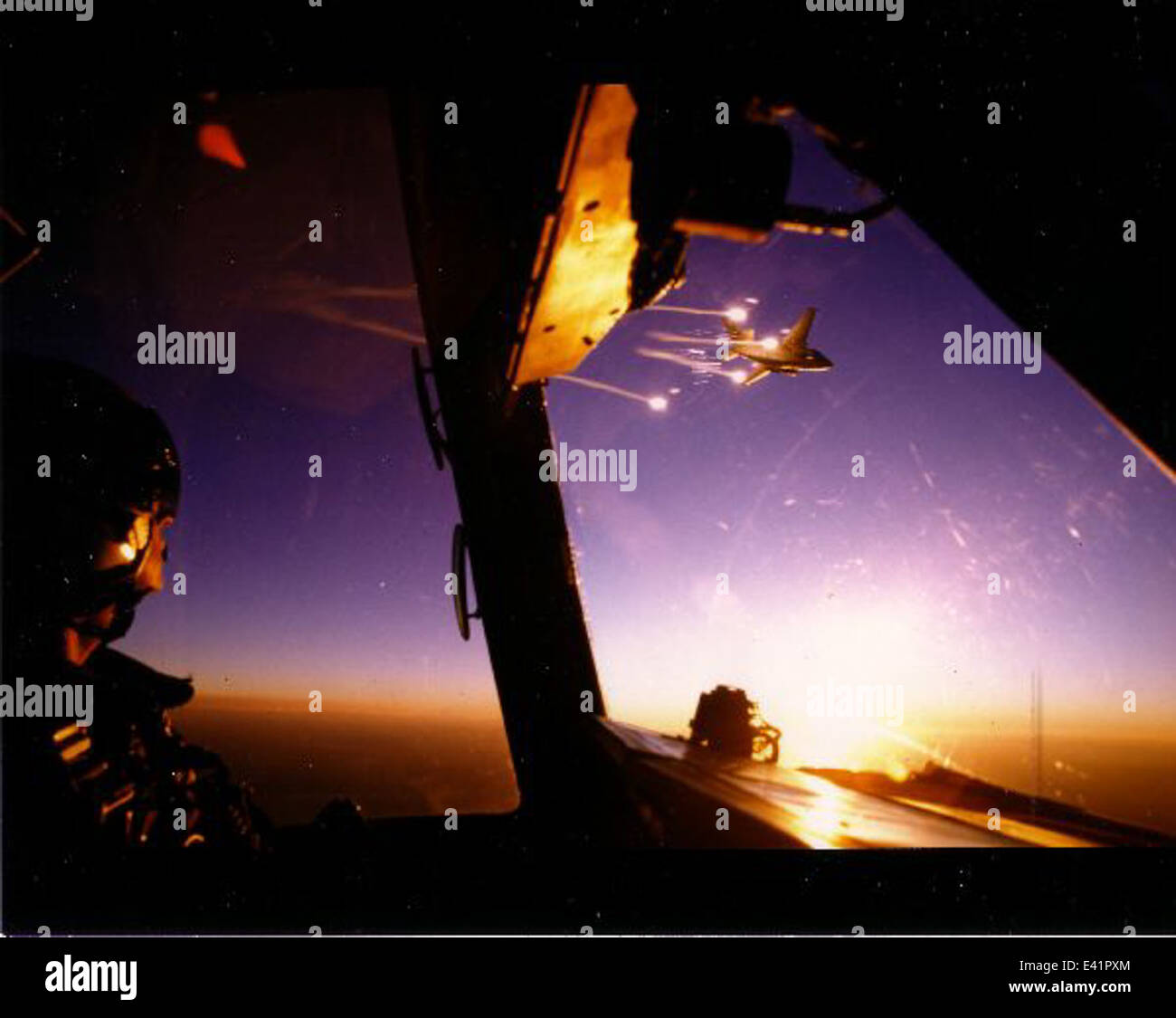 This photograph captures an S-3B Viking aircraft launching flares ...