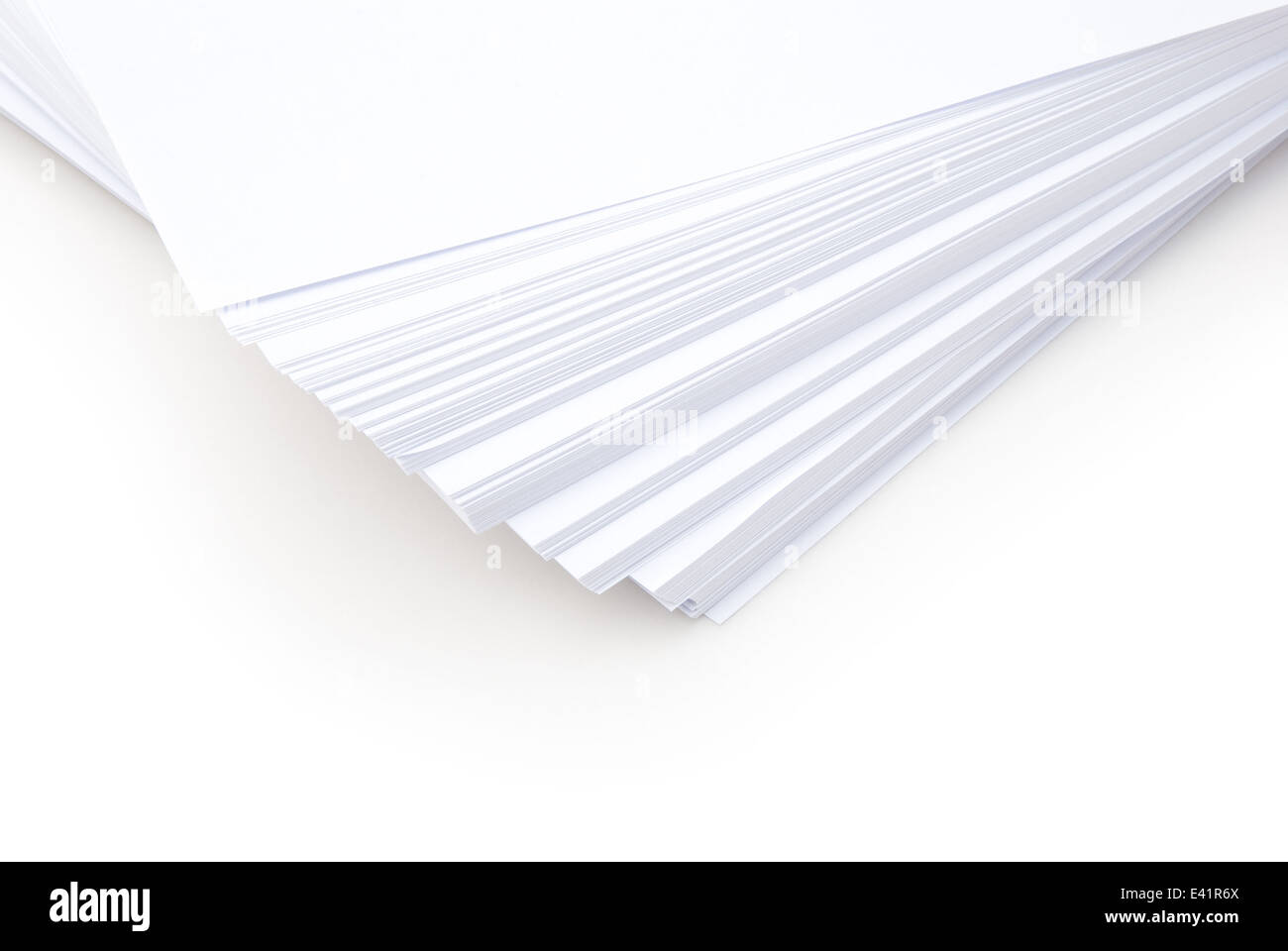 Stacked white paper on white background Stock Photo - Alamy