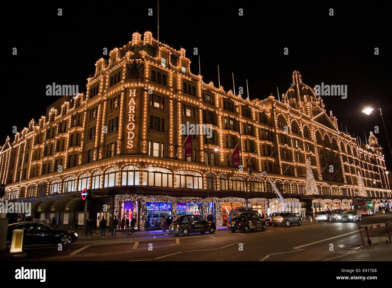 Workmen prepare the facade of London's famous Harrods department store ...
