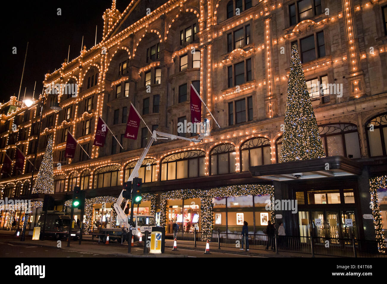 Workmen prepare the facade of London's famous Harrods department store ...