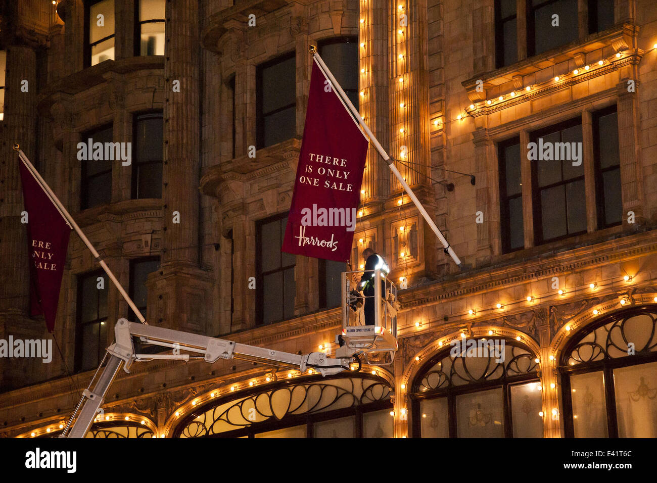 Workmen prepare the facade of London's famous Harrods department store ...