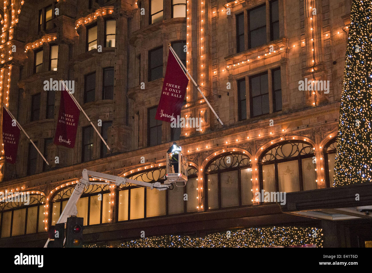Workmen prepare the facade of London's famous Harrods department store ...