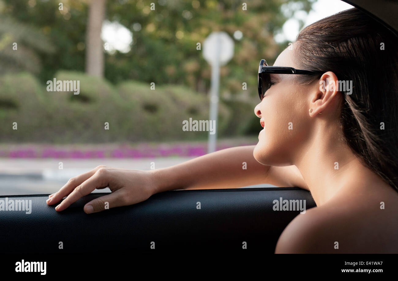 Woman leaving through window hi-res stock photography and images - Alamy