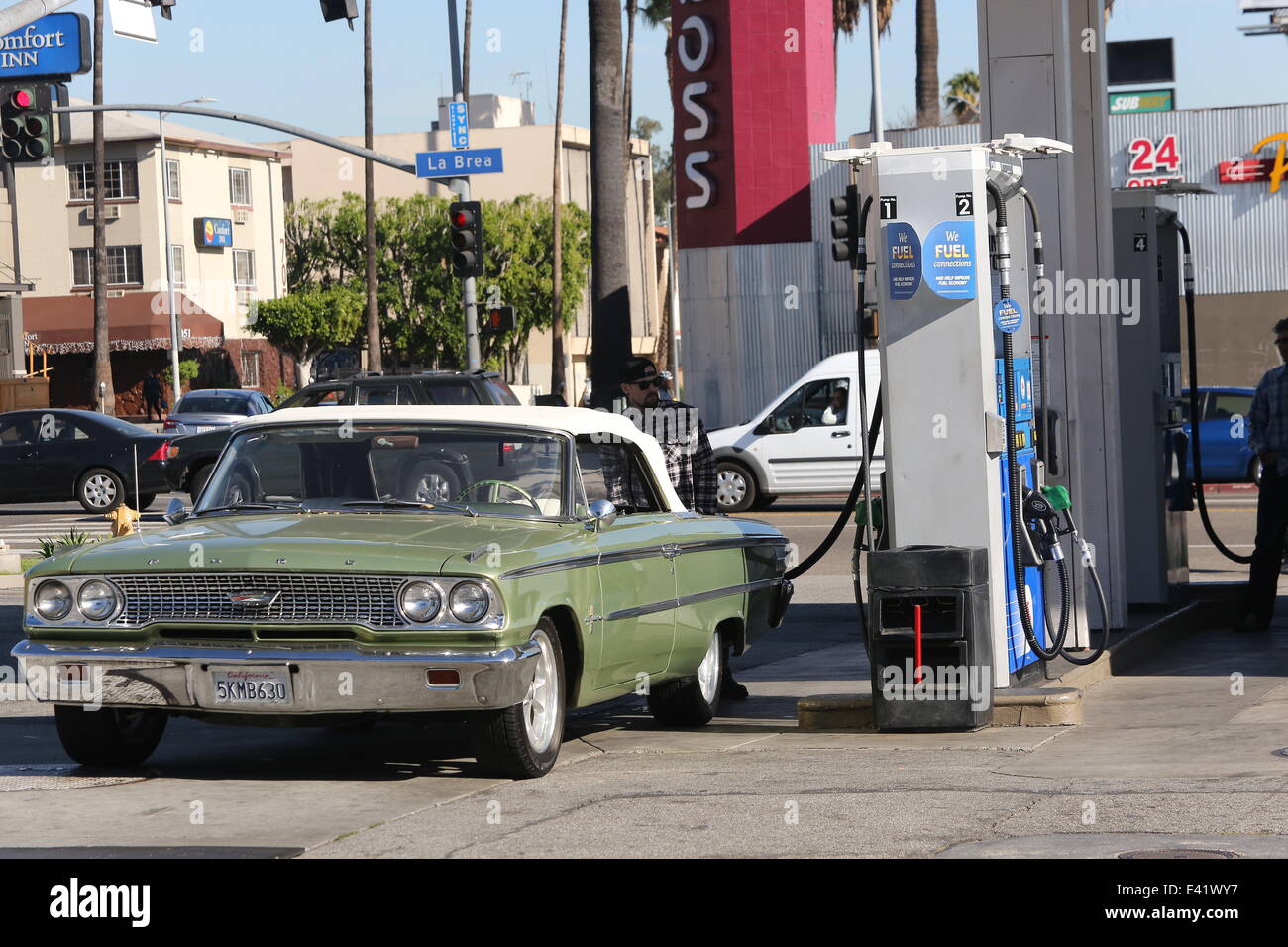 Benji Madden pumping gas in West Hollywood in his mint green classic ...