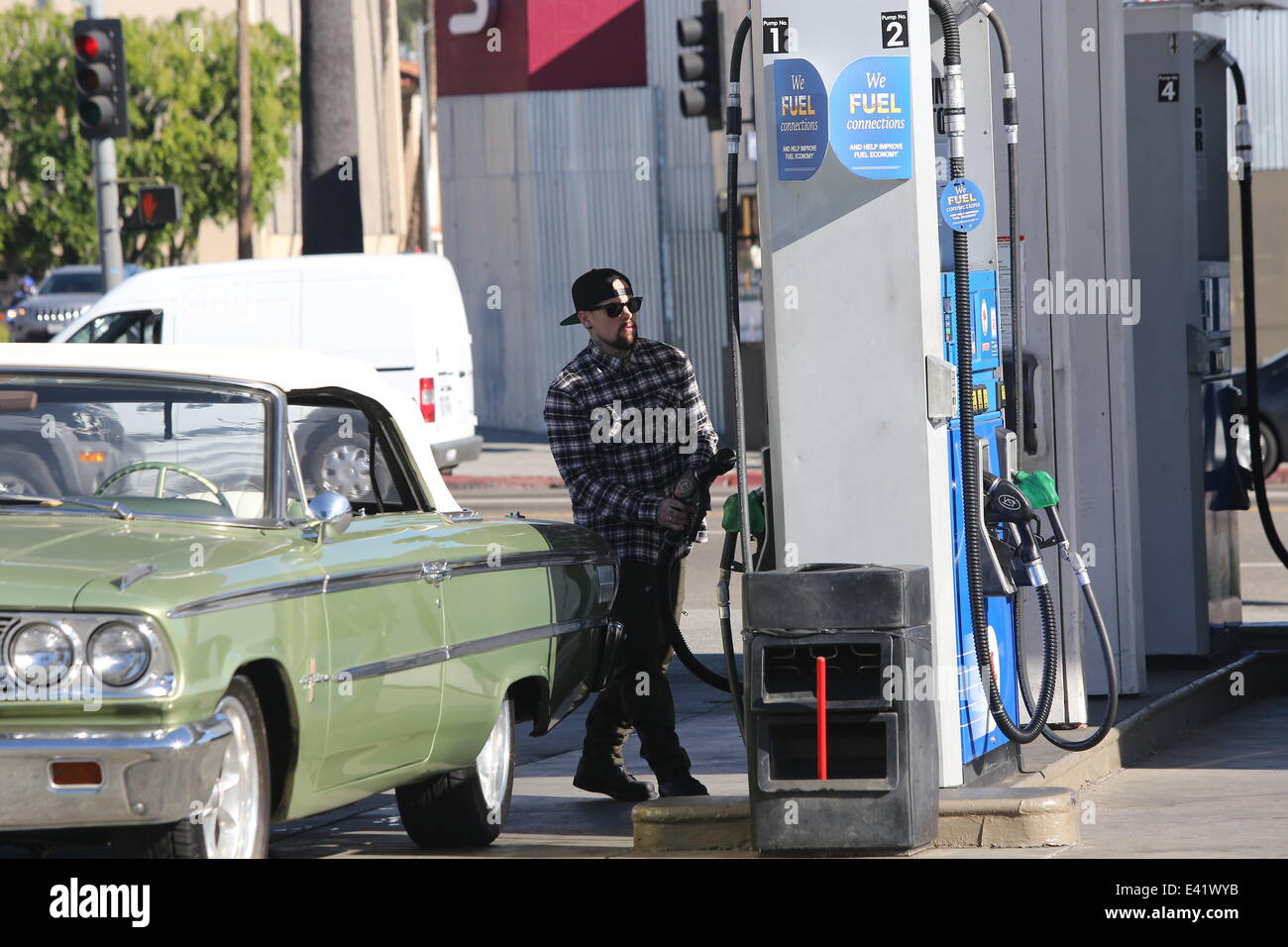 Benji Madden pumping gas in West Hollywood in his mint green classic ...