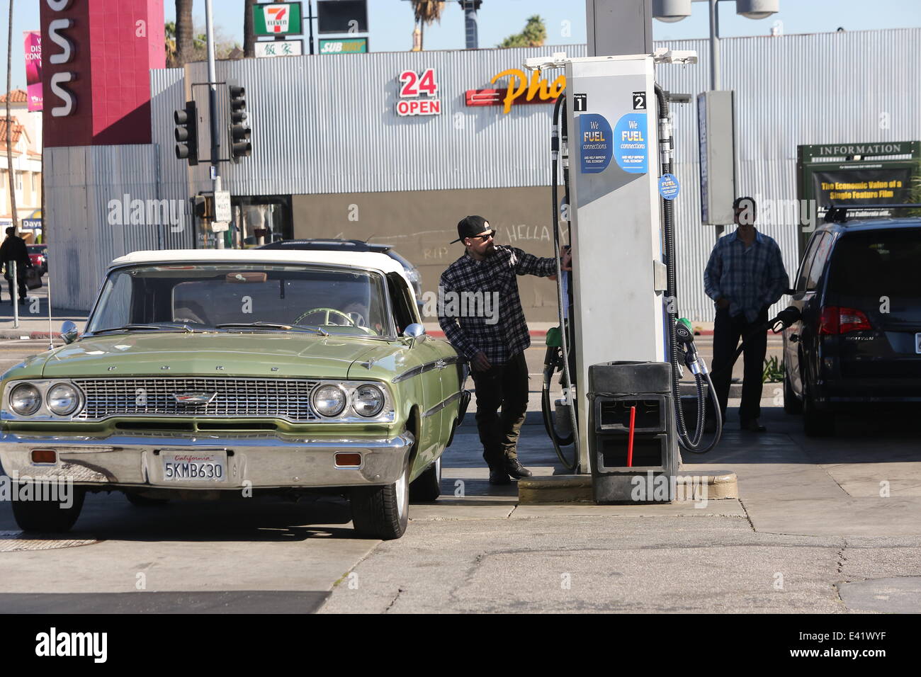 Benji Madden pumping gas in West Hollywood in his mint green classic ...