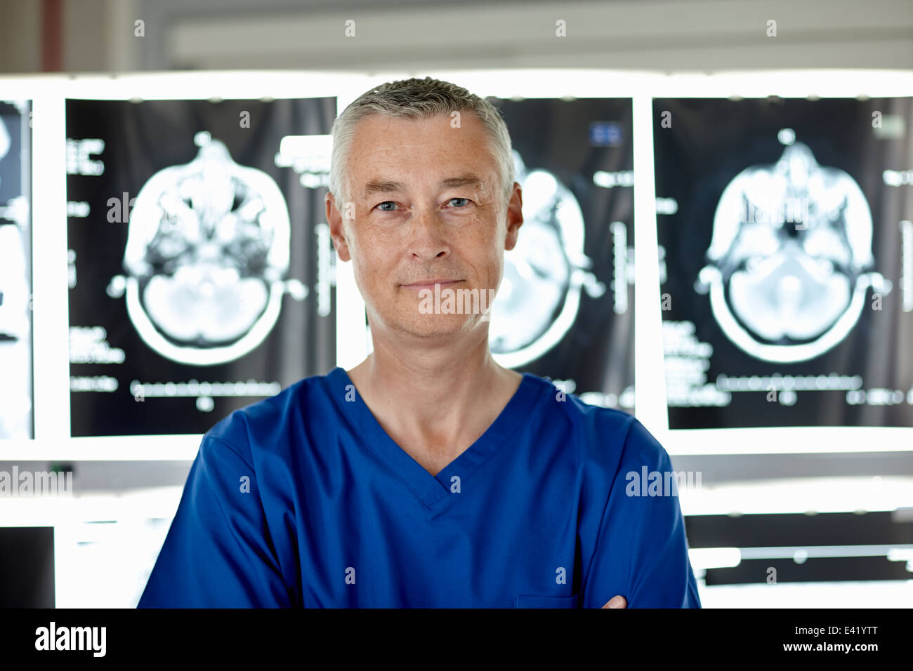 Radiologist standing in front of brain scans Stock Photo - Alamy