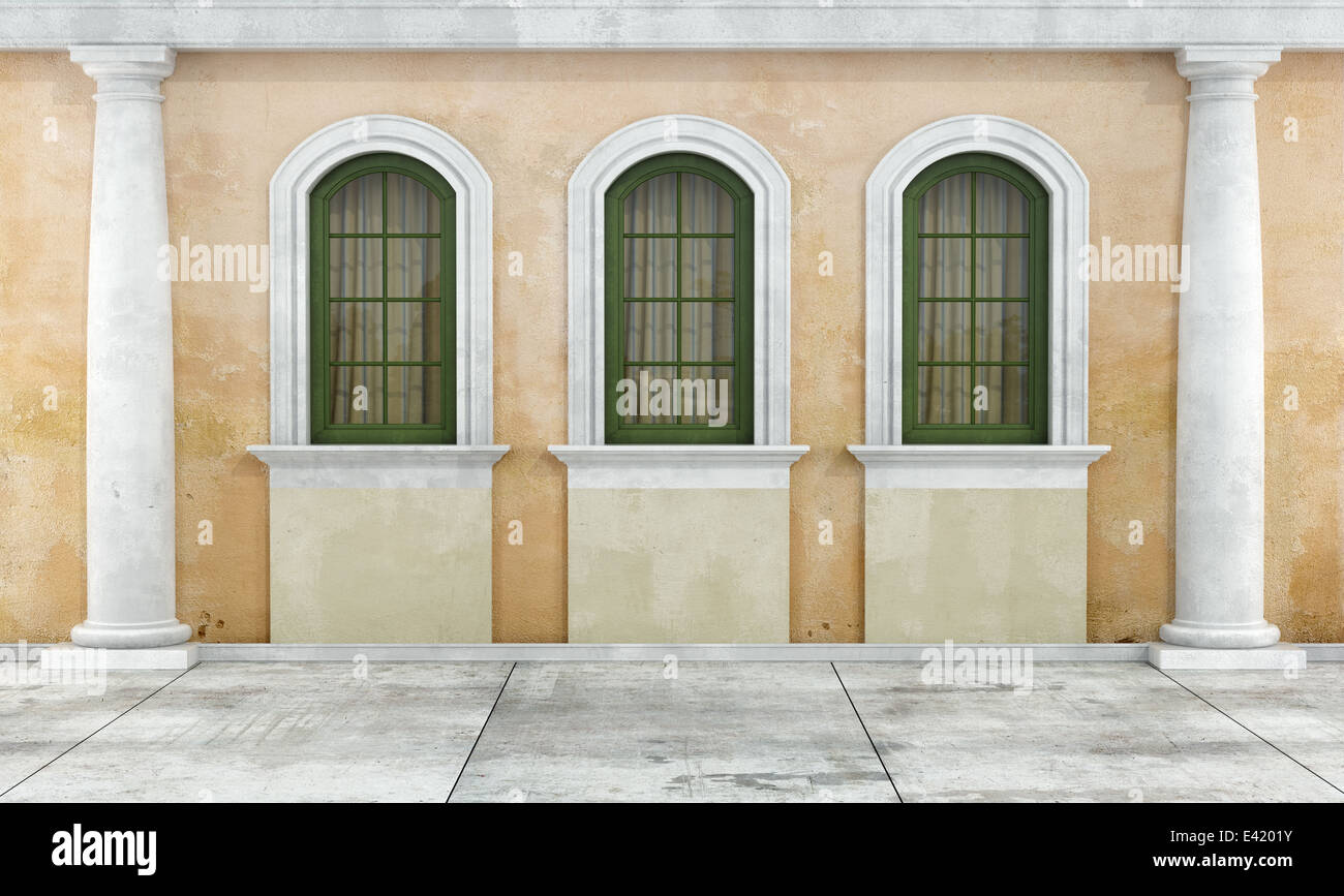 Courtyard of an old house with two arched windows and columns ...