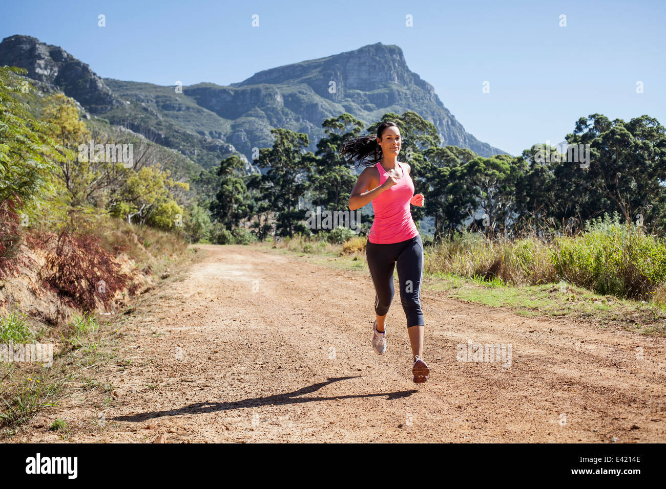 Young woman jogging in forest Stock Photo - Alamy