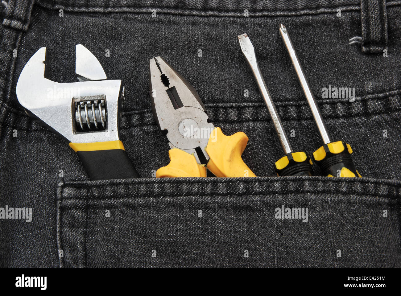 tools in a black jean back pocket Stock Photo - Alamy