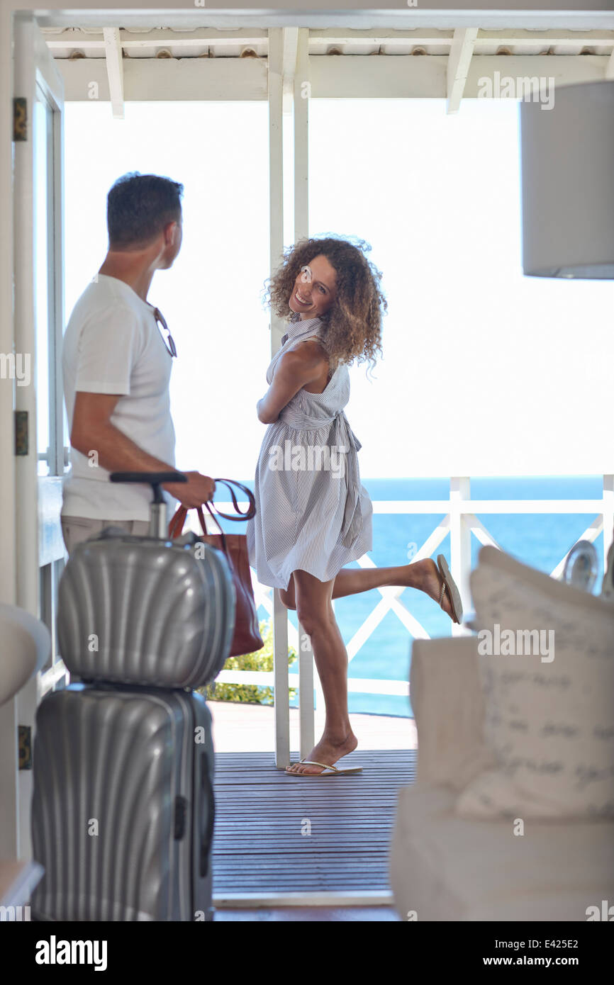 Couple fooling around at beach house apartment Stock Photo - Alamy