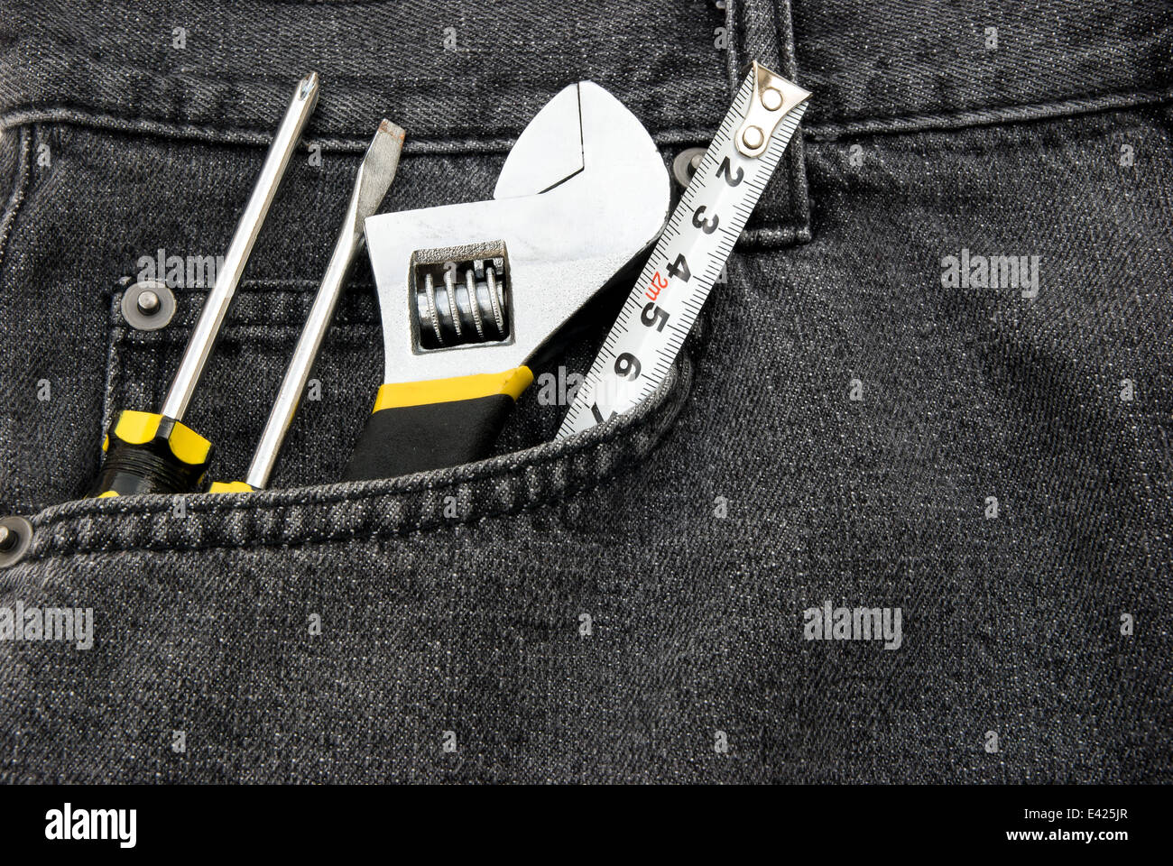 tools in a black jean front pocket Stock Photo - Alamy