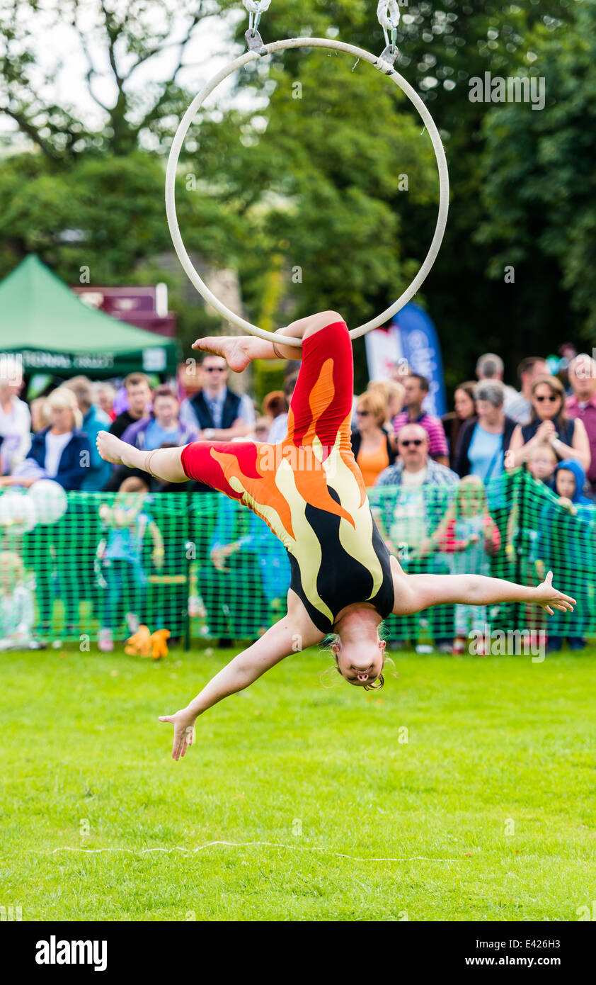Acrobat performing with a hoop Stock Photo - Alamy