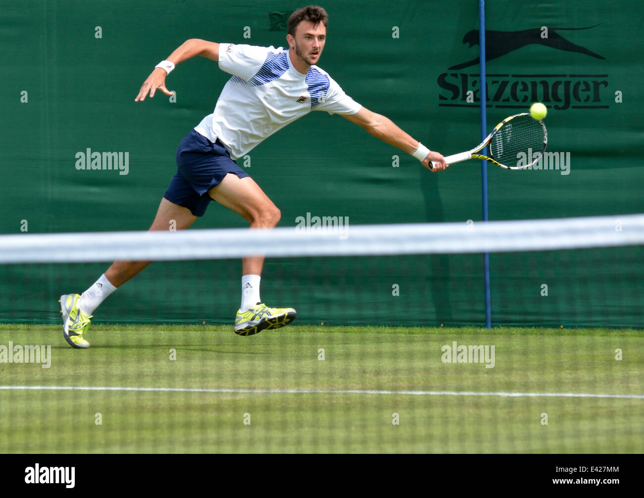 Manchester, UK 2nd July 2014 Harry Meehan plays a forehand return ...