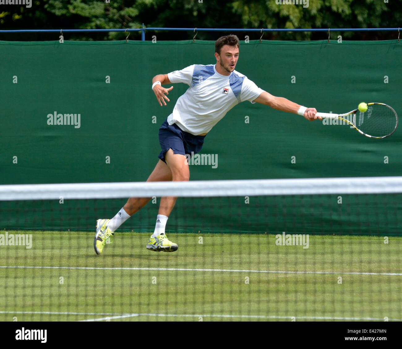 Manchester, UK 2nd July 2014 Harry Meehan plays a forehand return ...