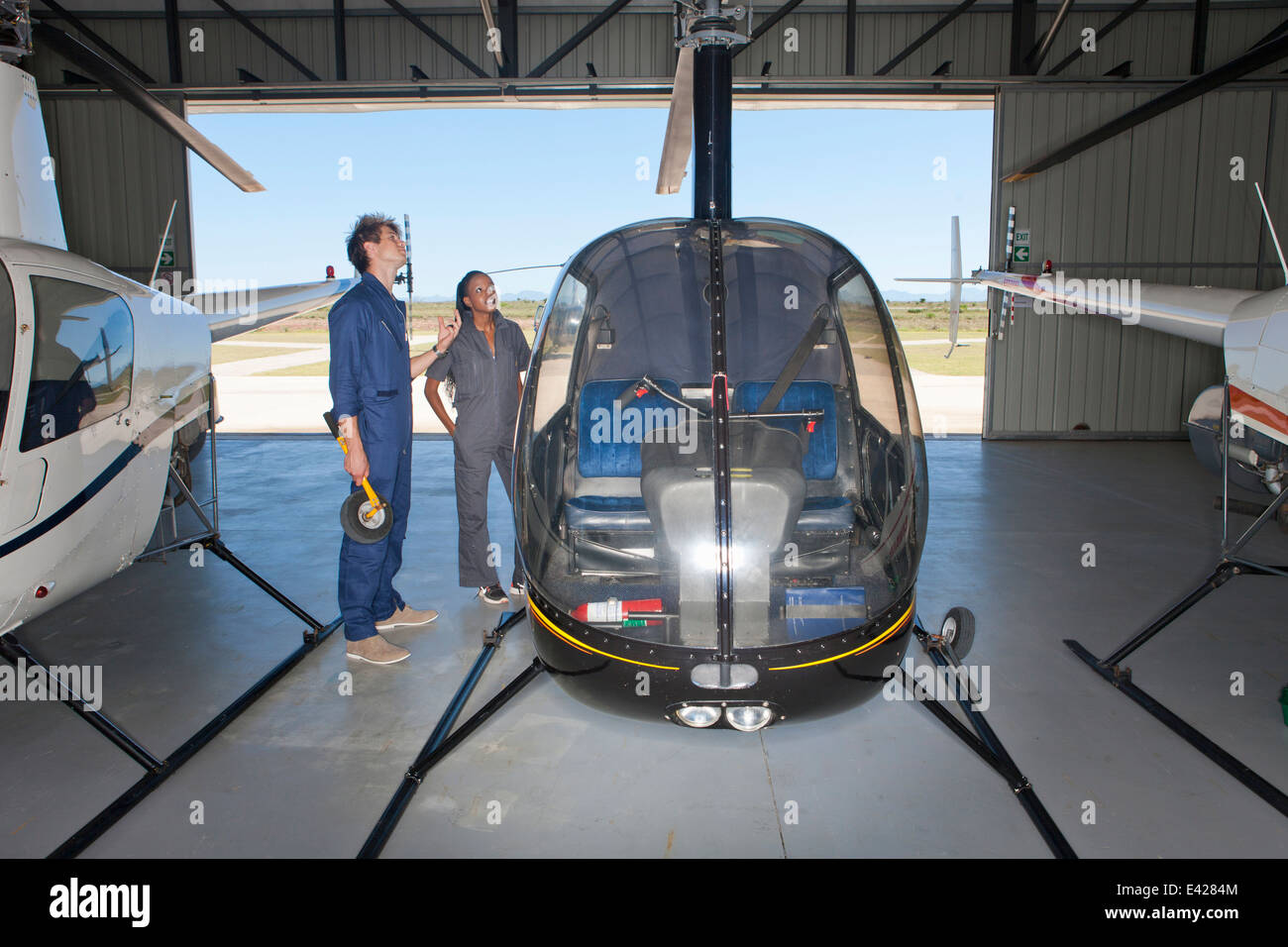 Young woman pilot checking hi-res stock photography and images - Alamy