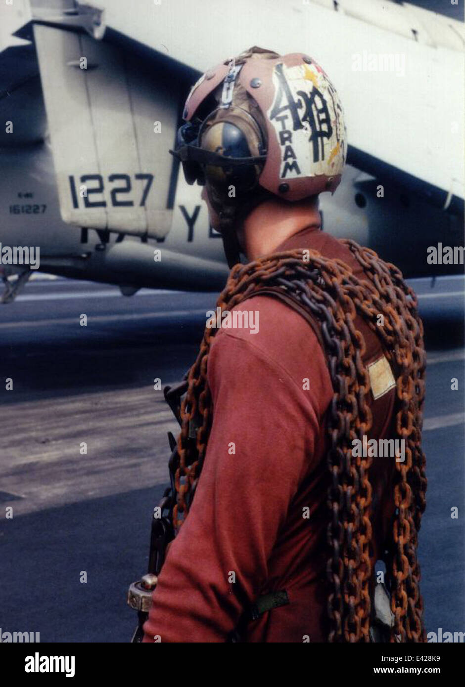 A photograph showing a plane captain, a U.S. Navy sailor responsible ...
